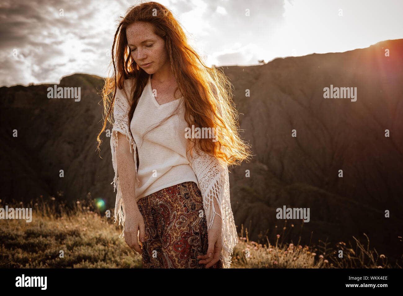 Beautiful hippie young beautiful woman with red hair dressed in boho ...