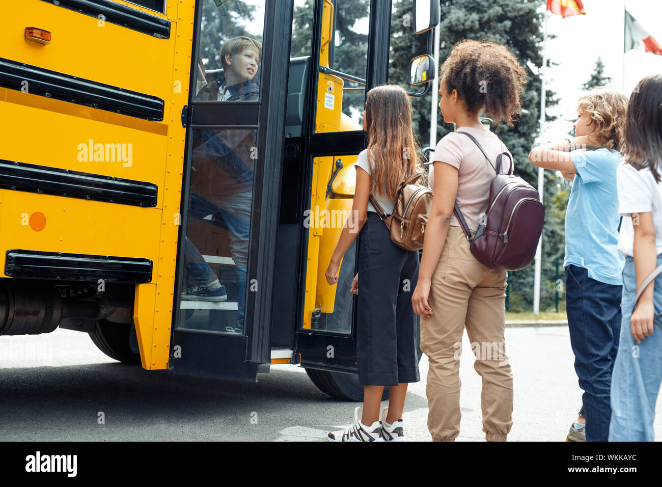 Schoolboys and schoolgirls queue hi-res stock photography and images ...
