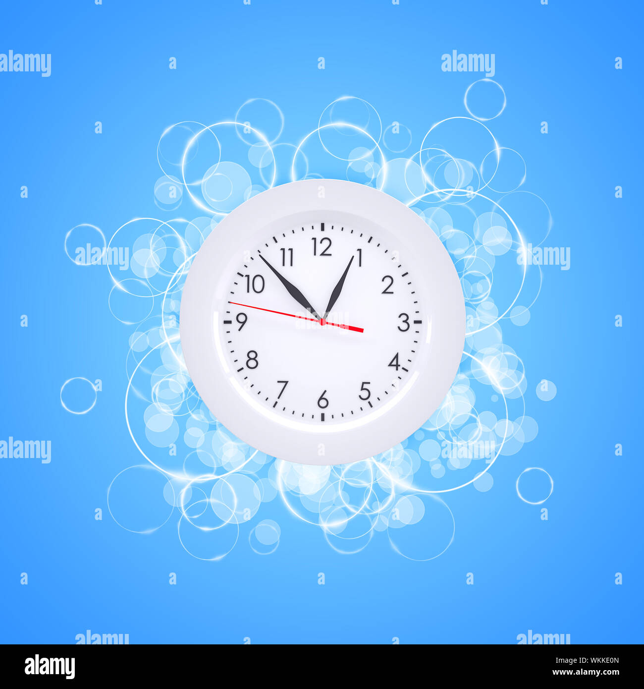 Clock face with glow circles. Blue background Stock Photo - Alamy
