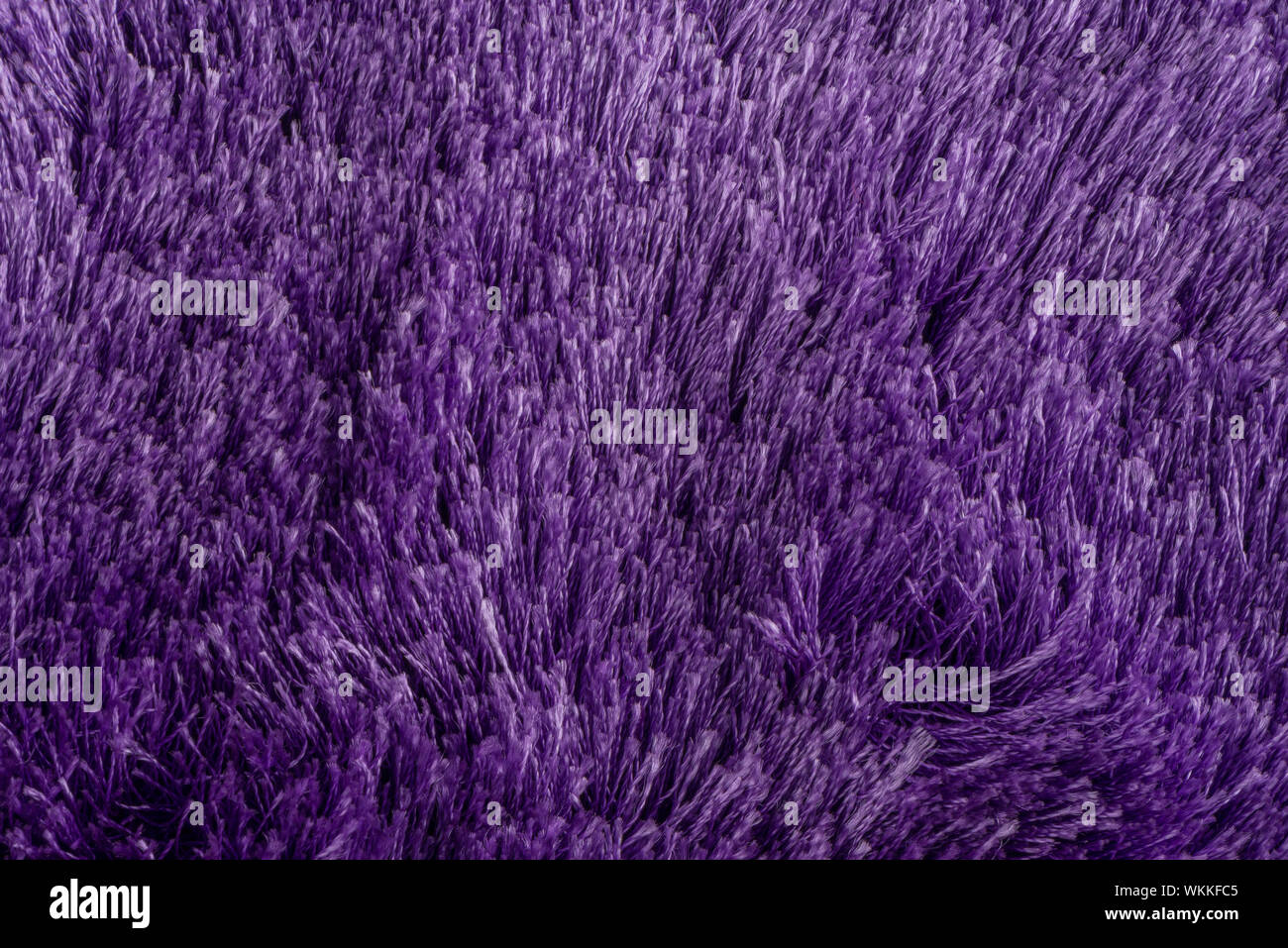 Closeup detail of purple carpet texture background Stock Photo - Alamy