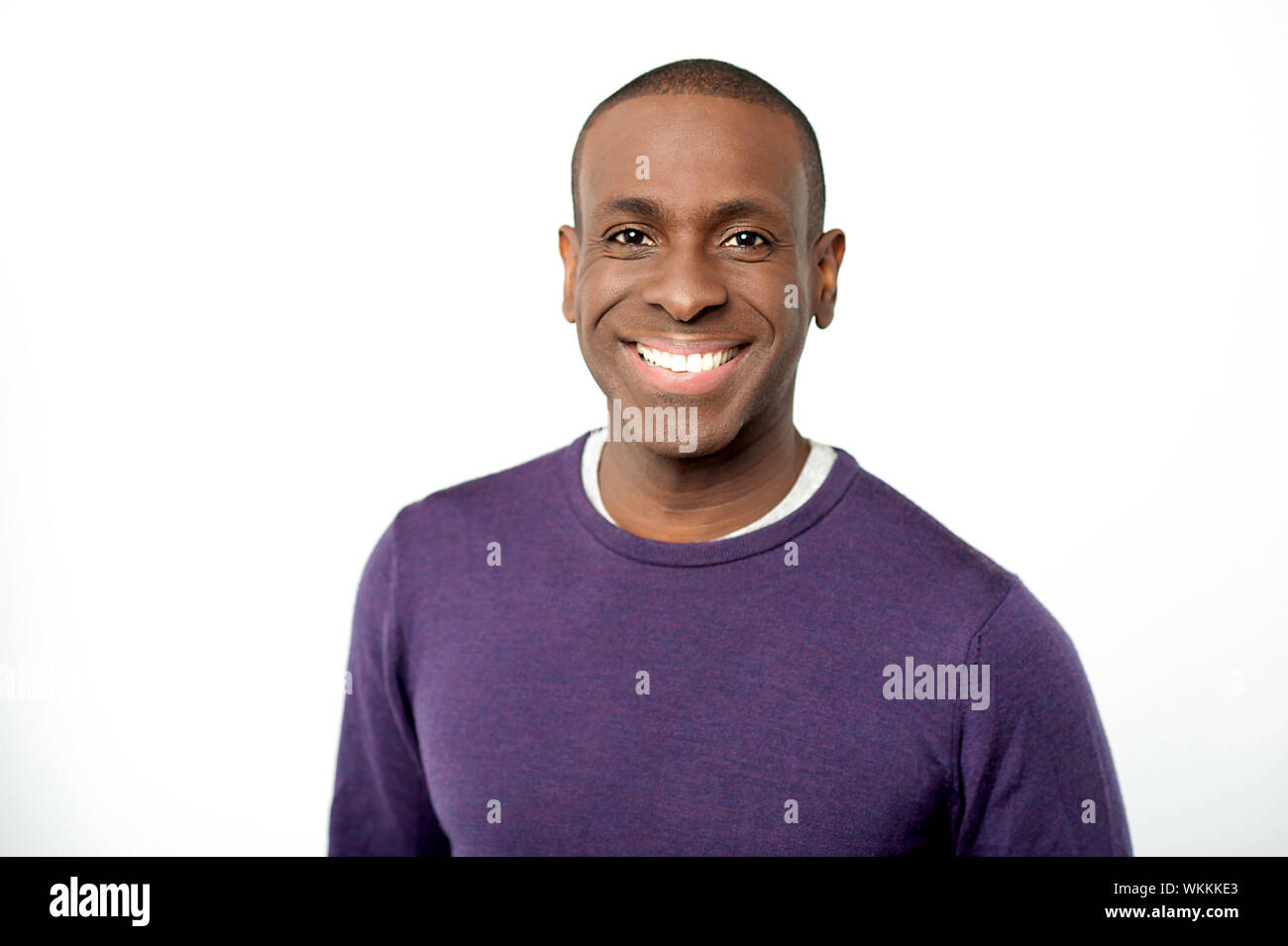 Smiling middle aged african man looking at camera Stock Photo - Alamy