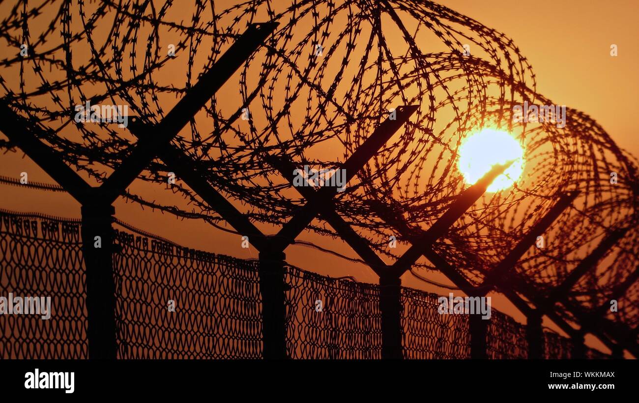Barbed wire at sunset hi-res stock photography and images - Alamy