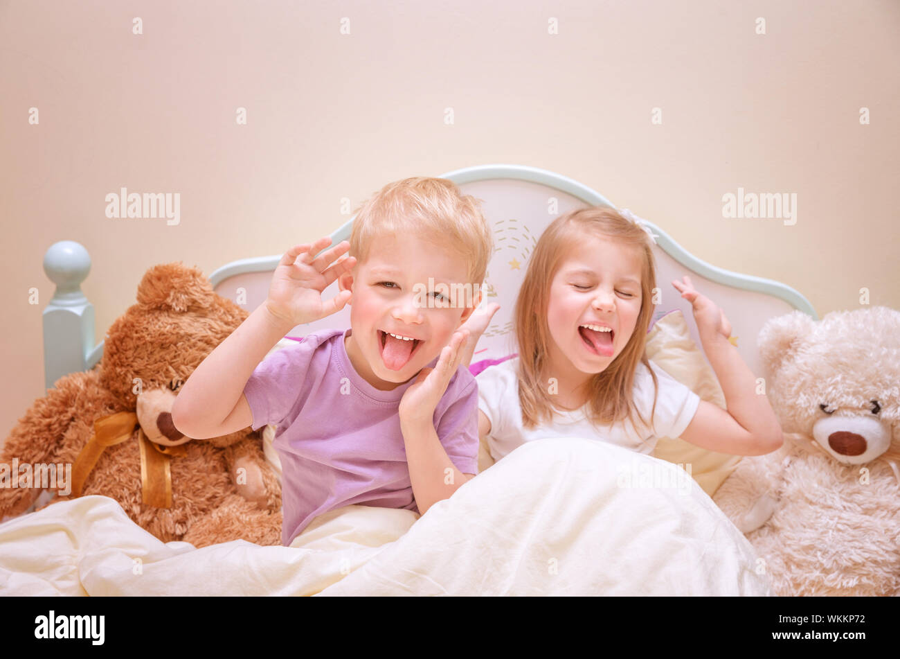Happy kids make faces Stock Photo - Alamy