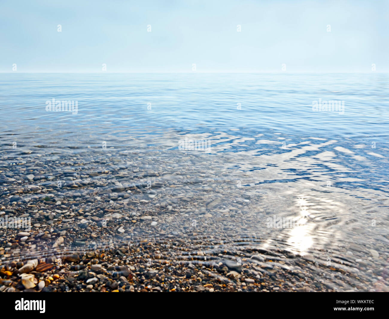 An image of a beautiful water background with pebbles Stock Photo - Alamy