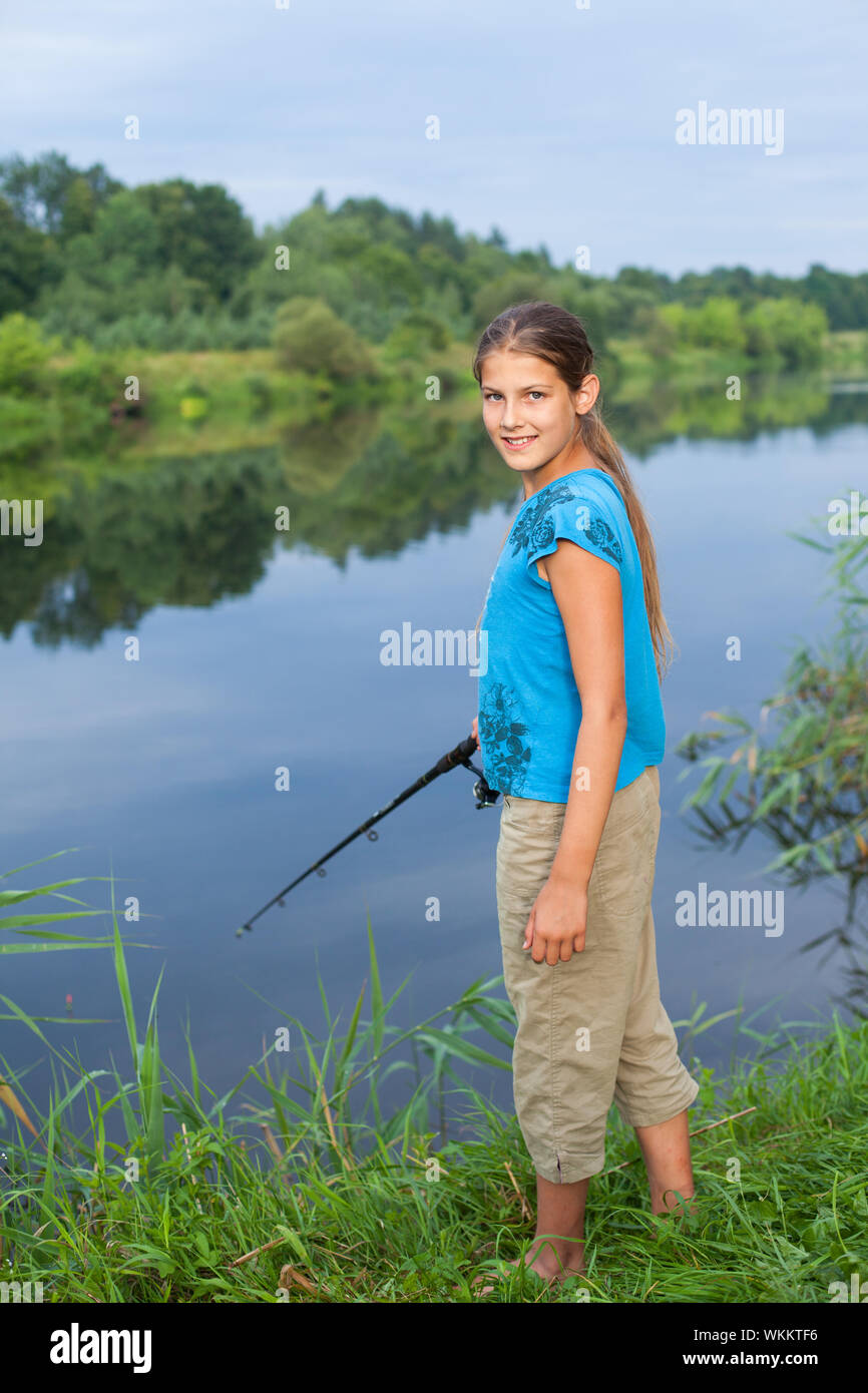 Summer vacation - Photo of cute girl fishing on the river Stock Photo ...