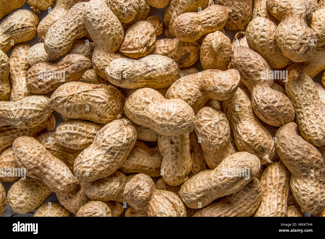 Pile of peanuts in shell background Stock Photo - Alamy