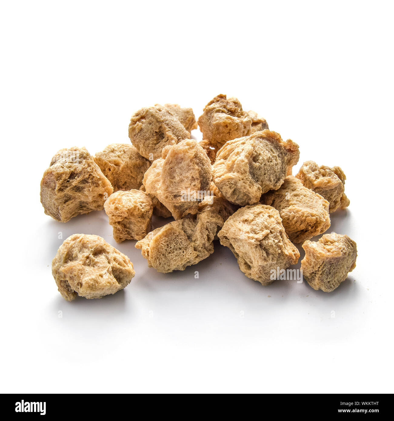 Pile of soy nuggets on white background Stock Photo - Alamy