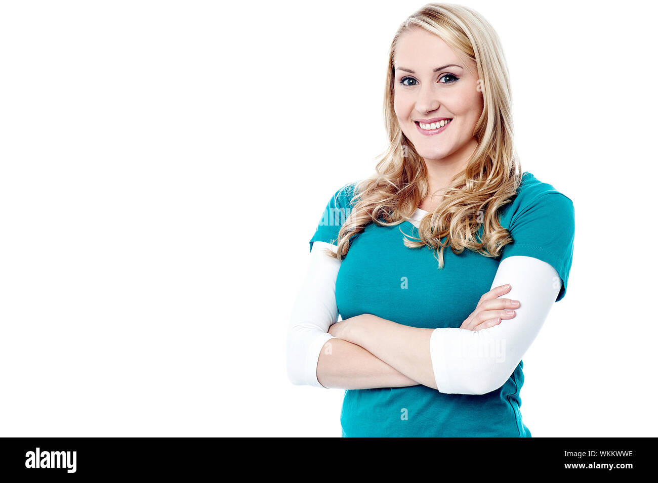 Beautiful young female posing with arms crossed Stock Photo - Alamy