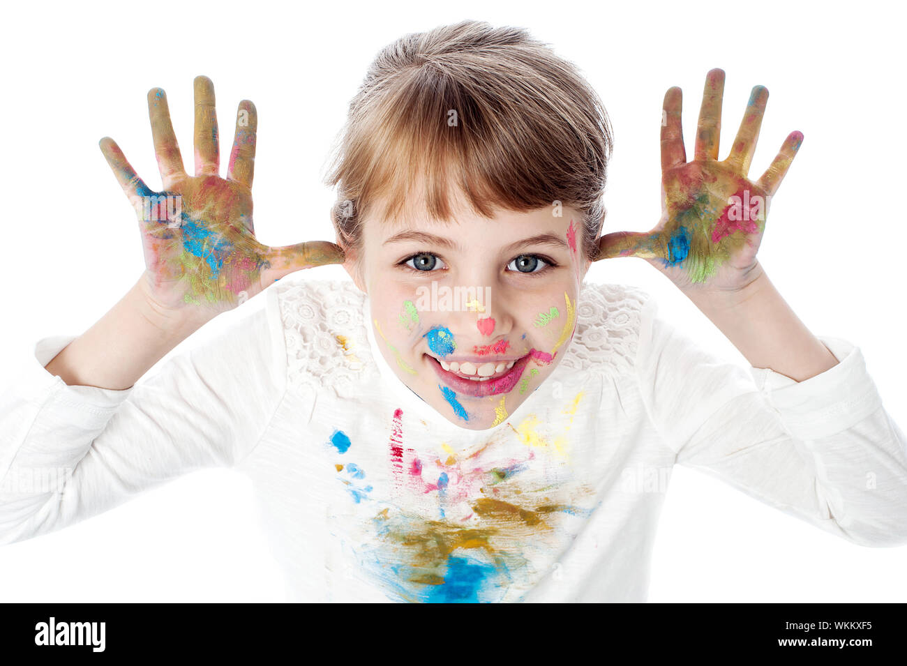 Beautiful little girl with messy hands of paint Stock Photo - Alamy