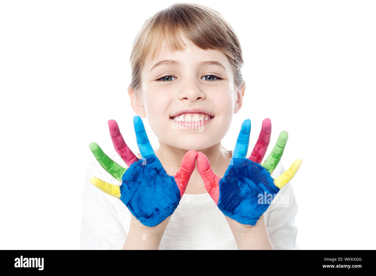 Beautiful girl playing with colors on white background Stock Photo - Alamy