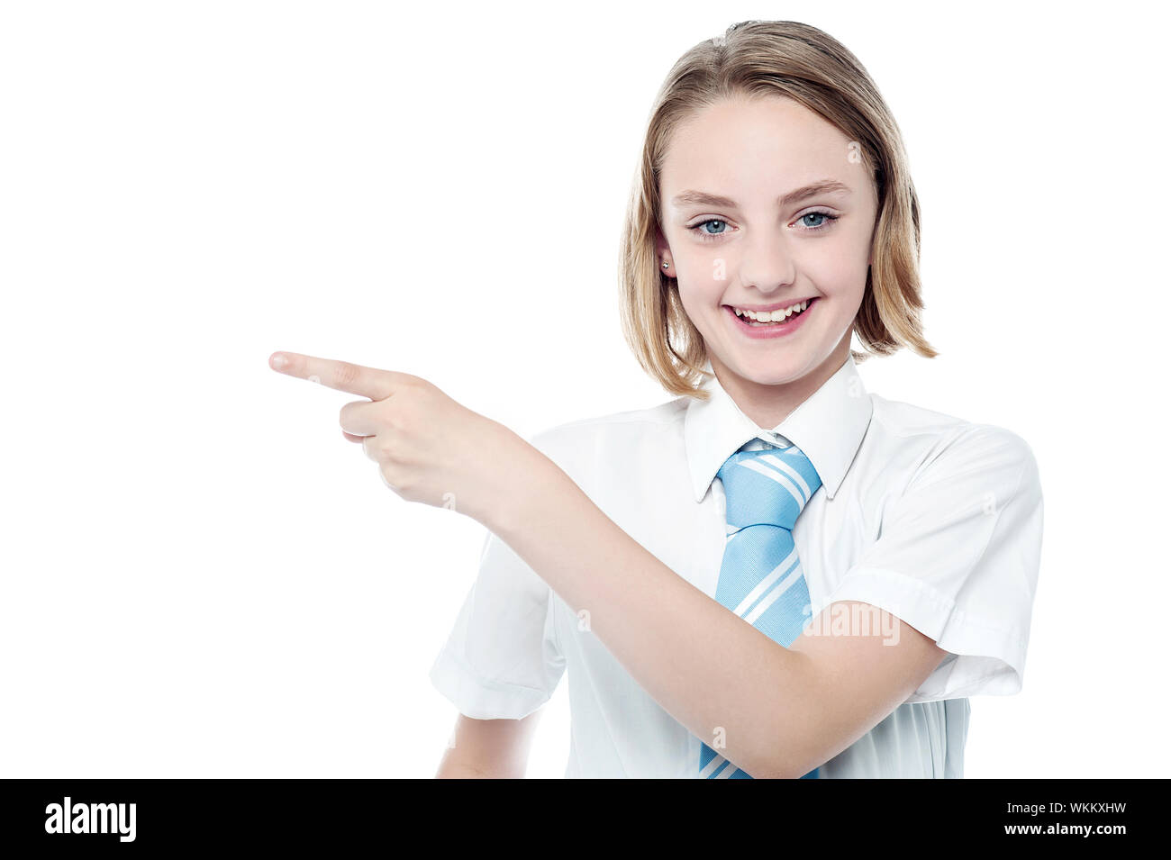 Young school girl pointing at something Stock Photo - Alamy