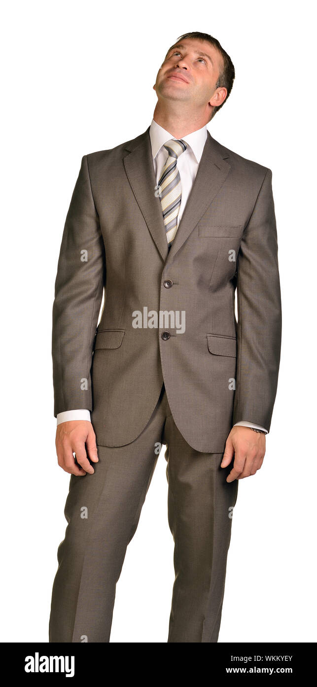 Joyful businessman looking up. Isolated on white background Stock Photo ...