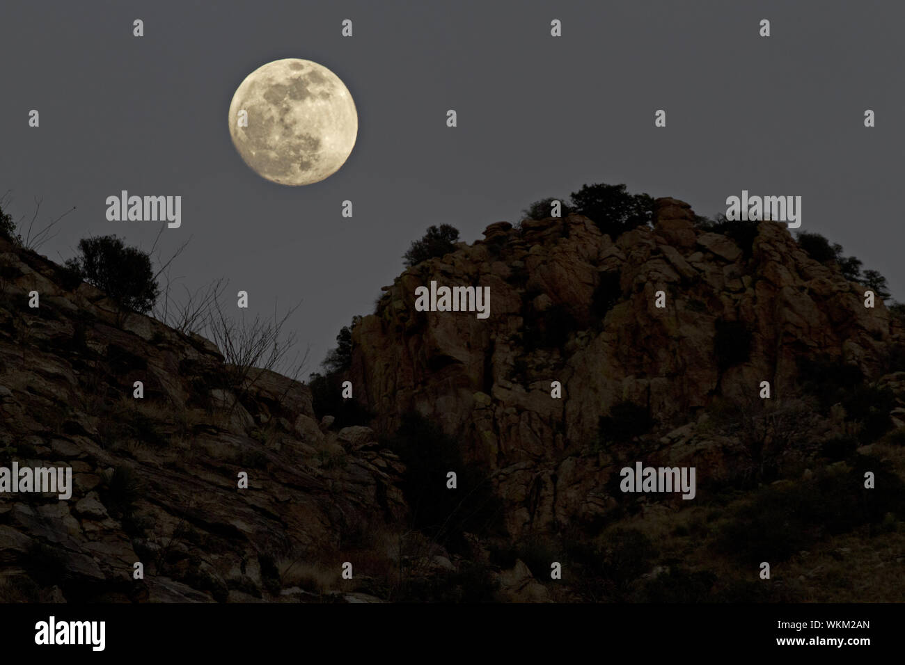 Full moon over rugged mountain ridges of Mt. Lemmon along Catalina ...