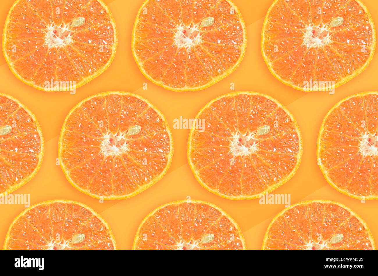 Sliced oranges pattern, fruit with one seed, orange tones on background ...