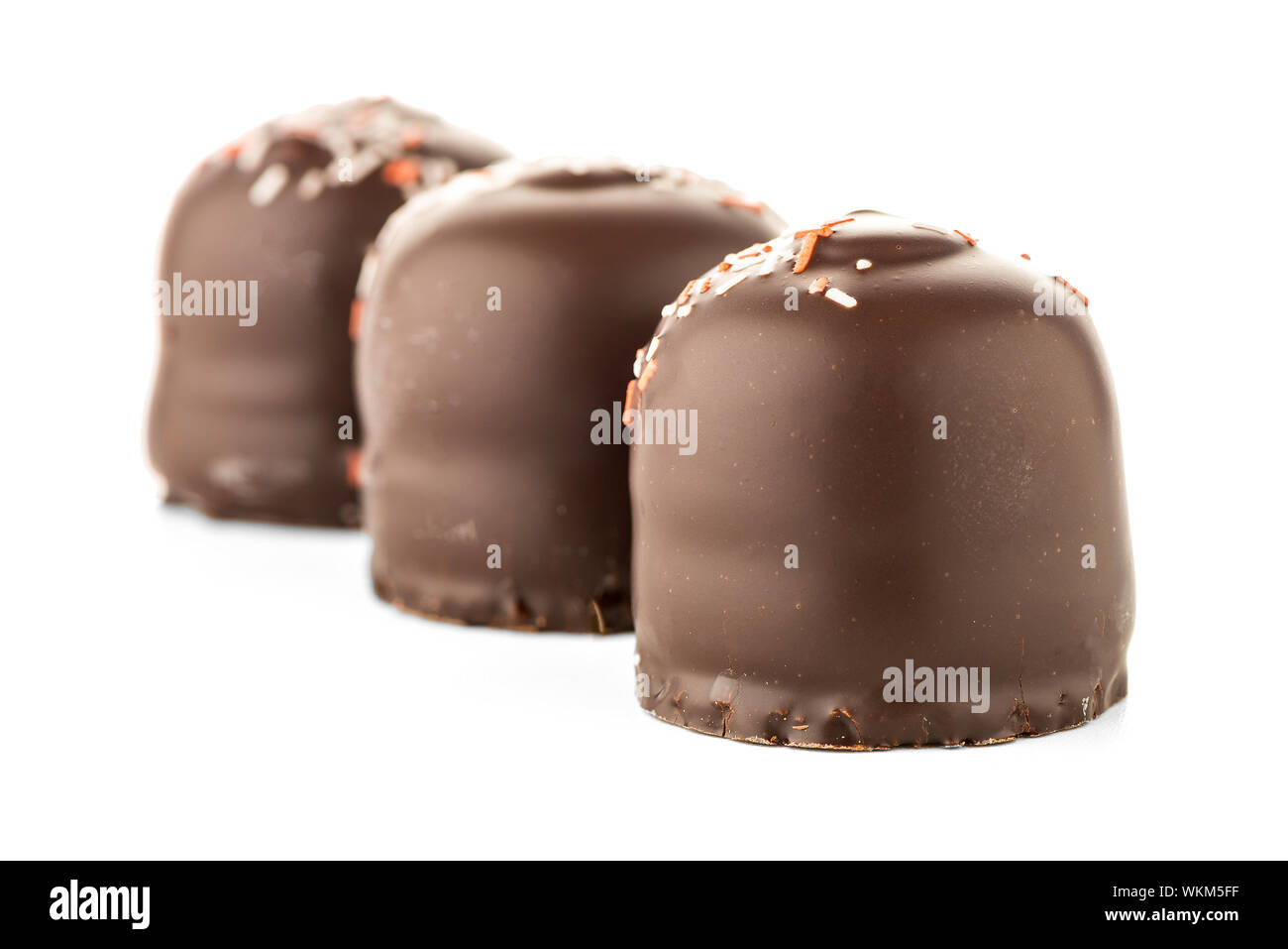 Chocolate coated marshmallows isolated on white background Stock Photo ...