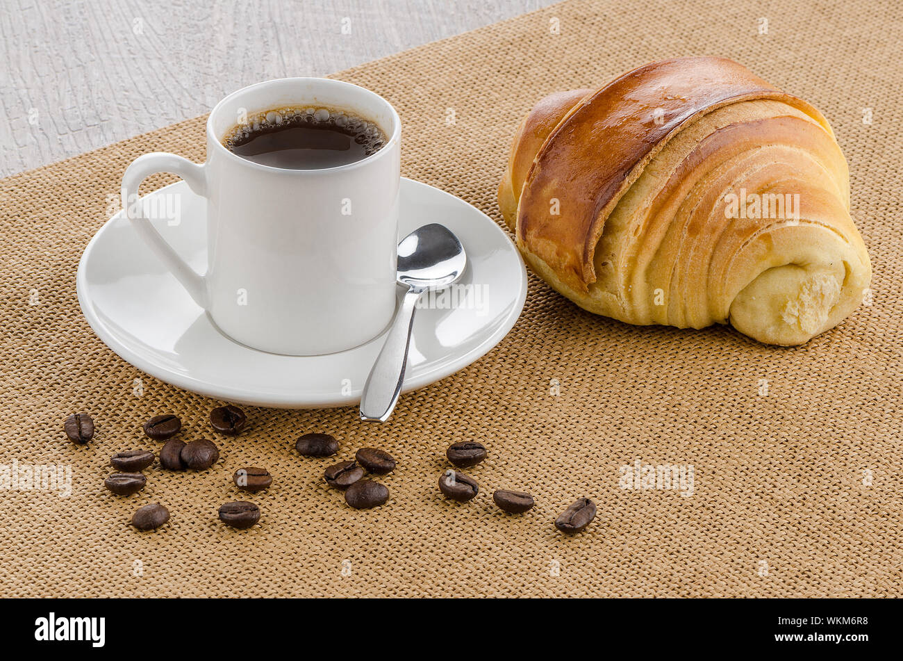 Cup of black coffee over sackcloth baclground Stock Photo - Alamy