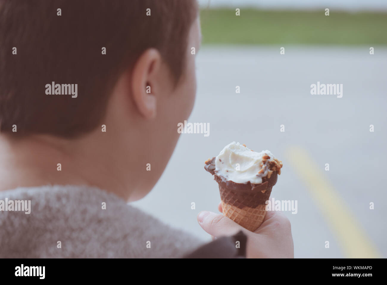 Boy eating ice cream cone hi-res stock photography and images - Alamy