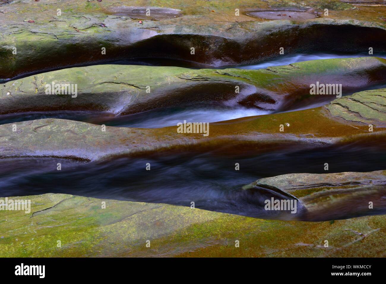 Rock gullies formed by water in the riverbed hi-res stock photography ...