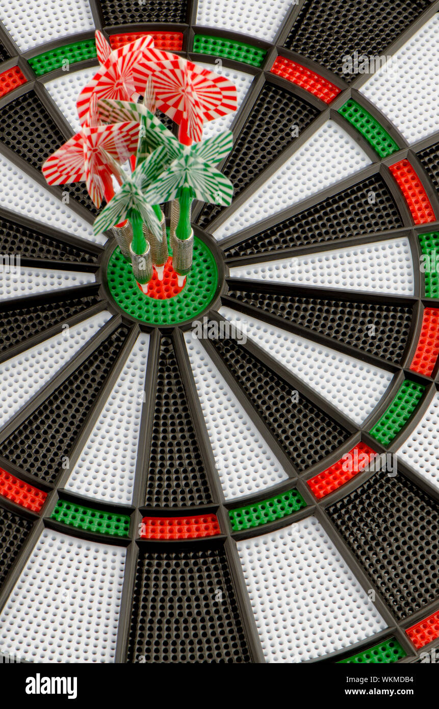 Closeup of dart board with darts Stock Photo - Alamy