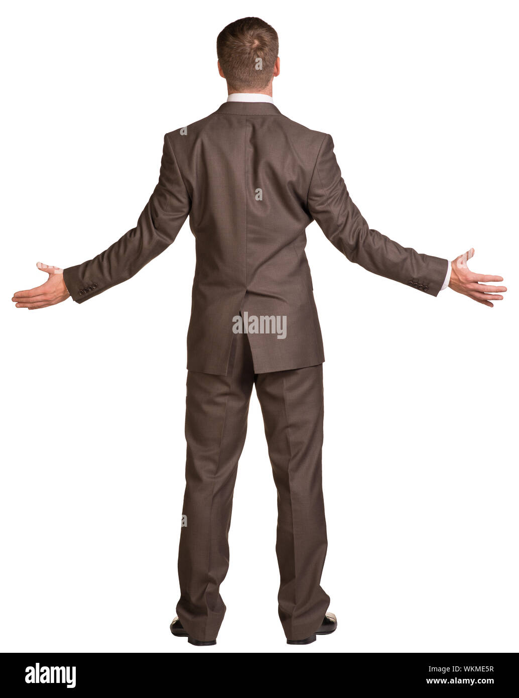 Businessman holding hands up to sides. Rear view. Isolated on white ...