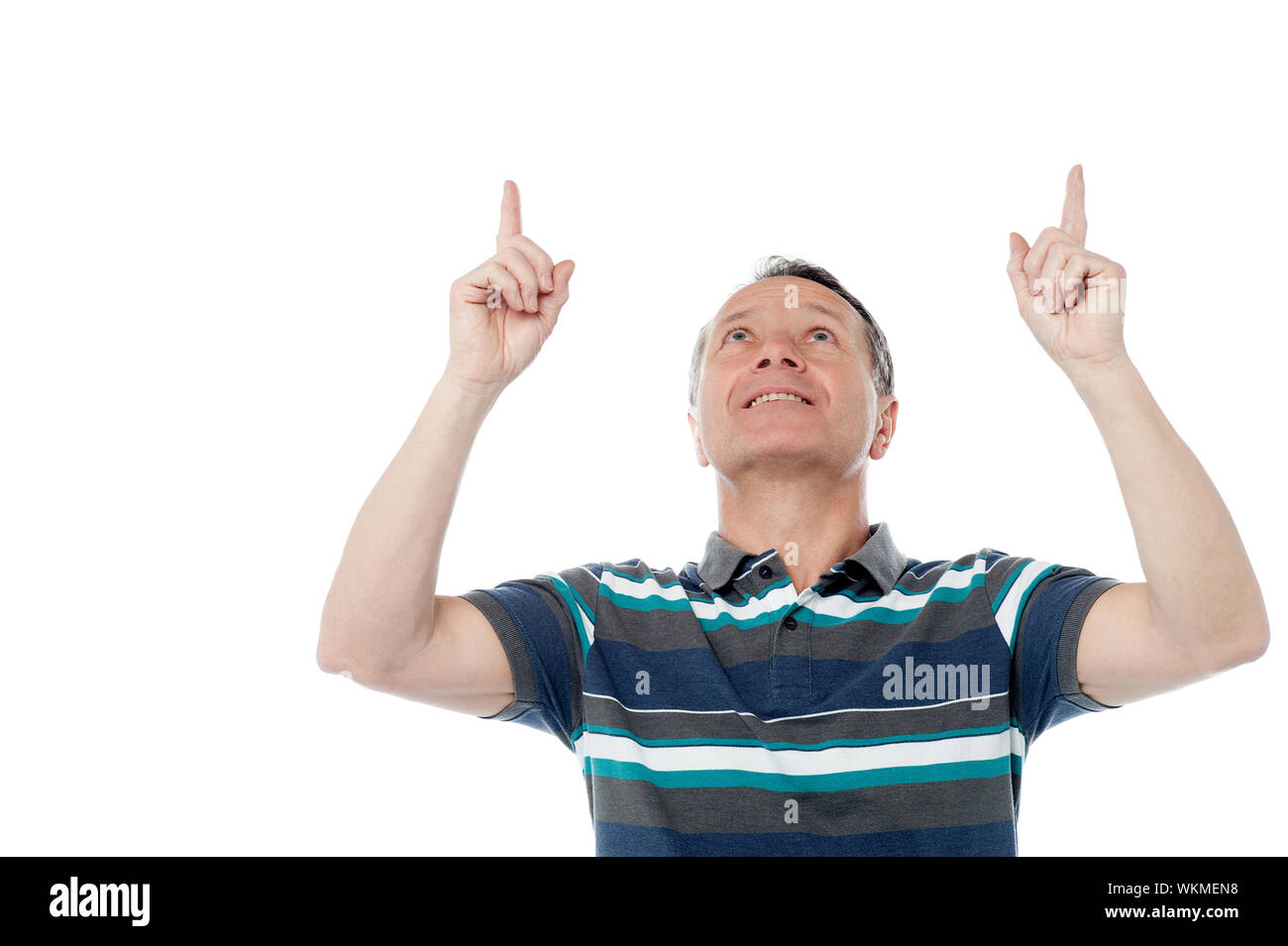 Happy aged man looking and pointing upwards Stock Photo - Alamy