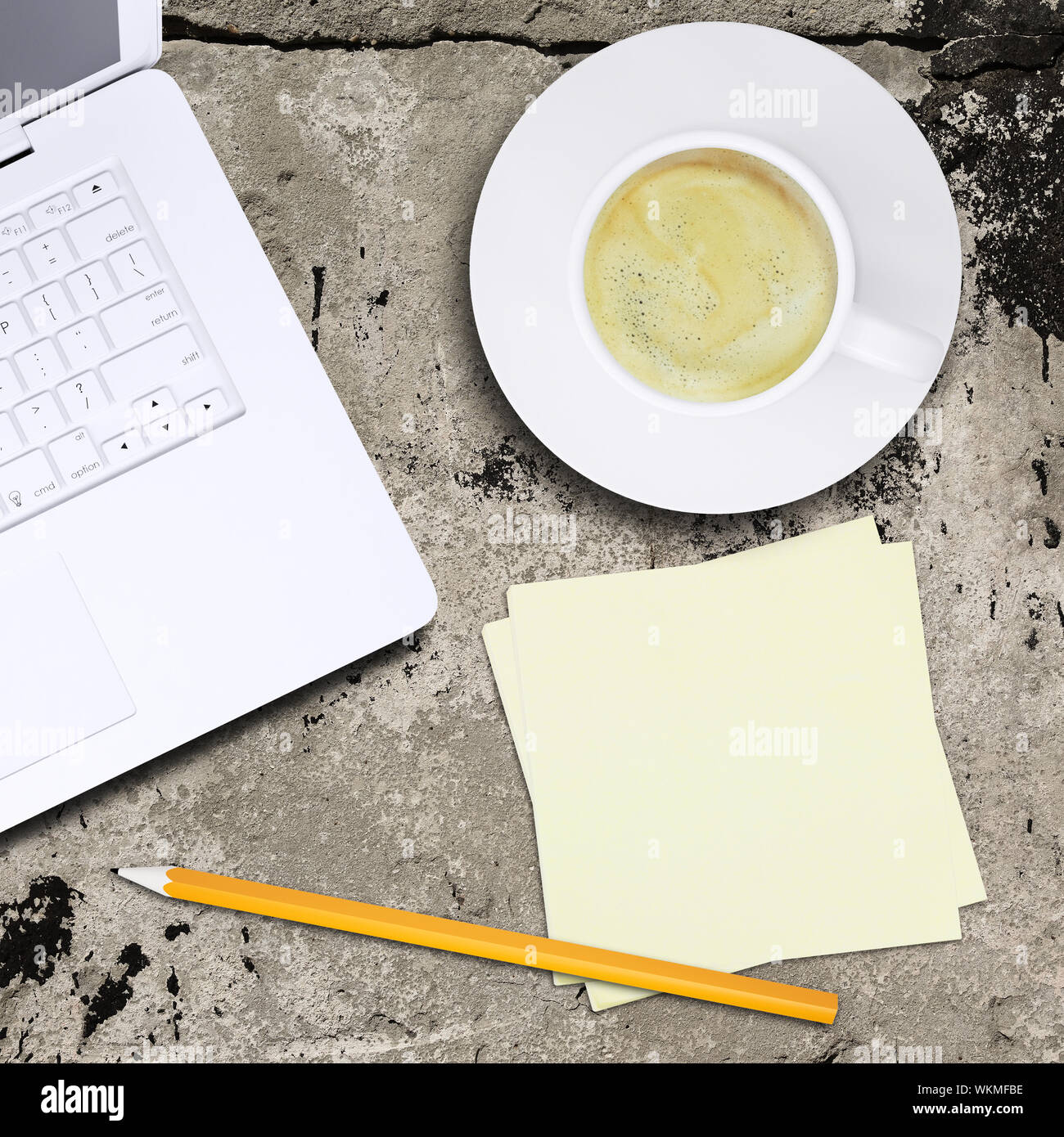 Laptop and coffee cup on old concrete surface. Computer technology ...