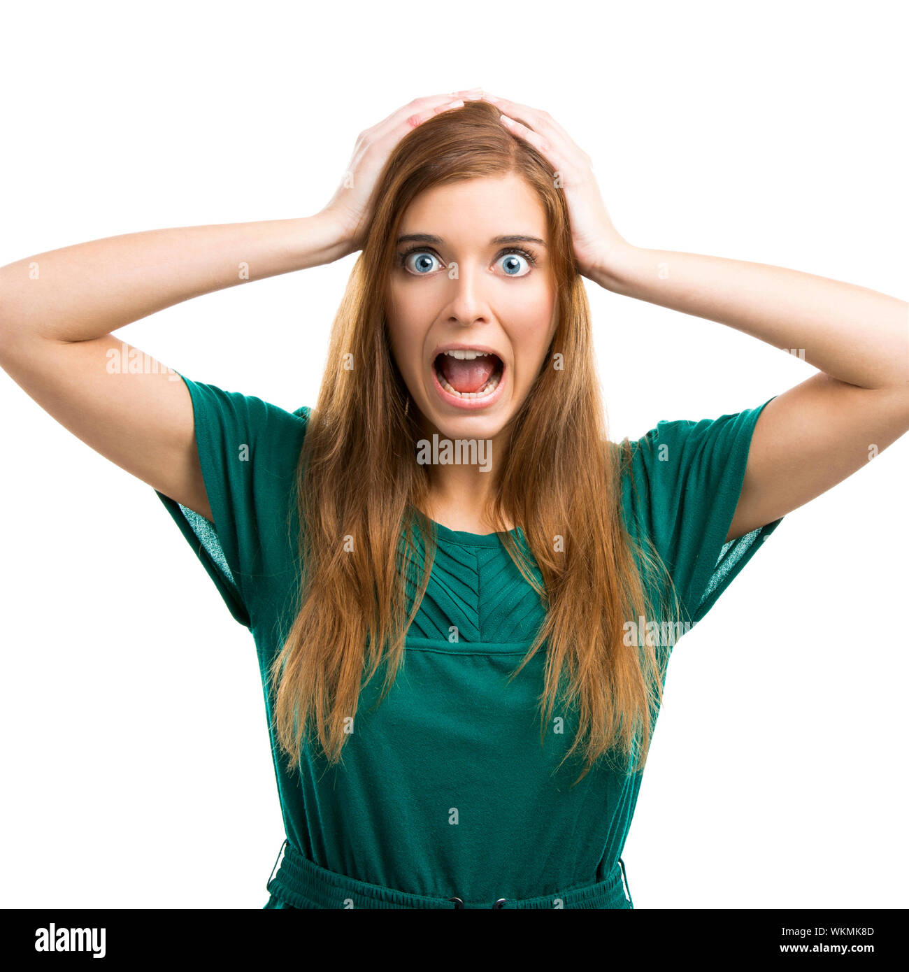 Portrait of a beautiful girl with a panic expression isolated on white ...