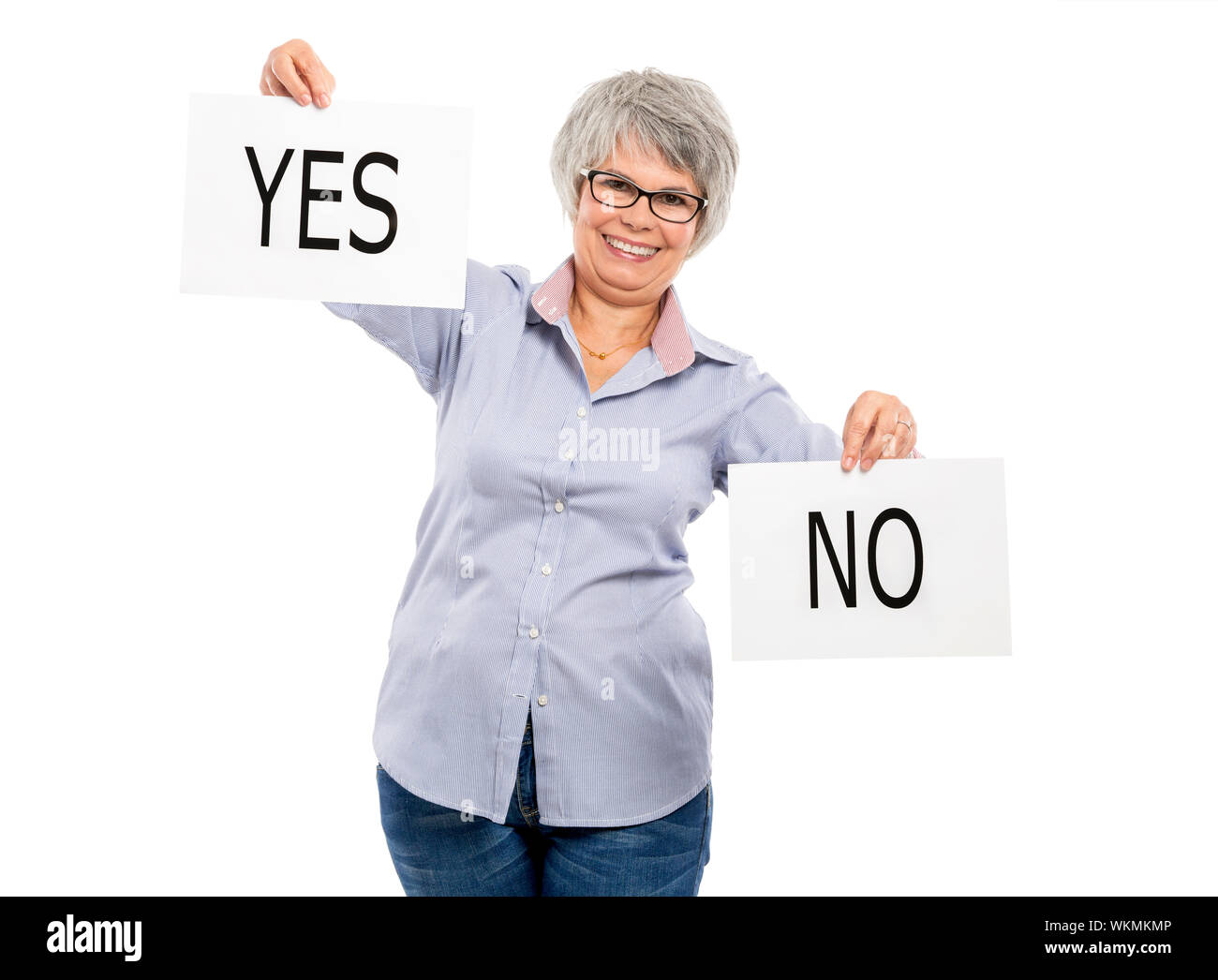 Happy elderly woman holding a paper card and choosing between Yes or No ...