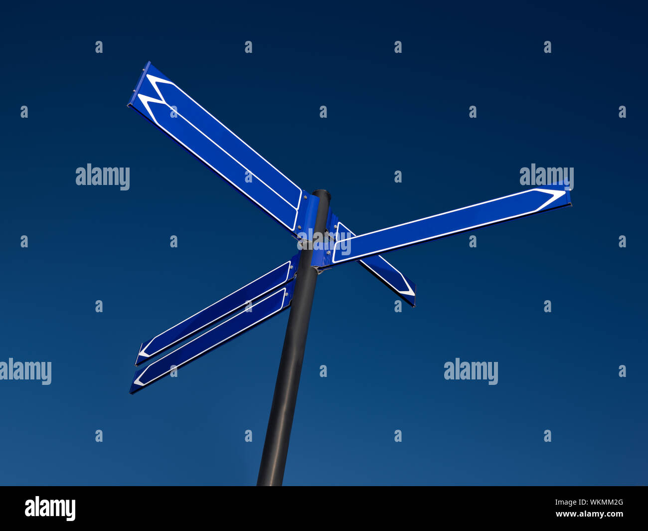 A blank signpost with six arrows against a blue sky Stock Photo - Alamy
