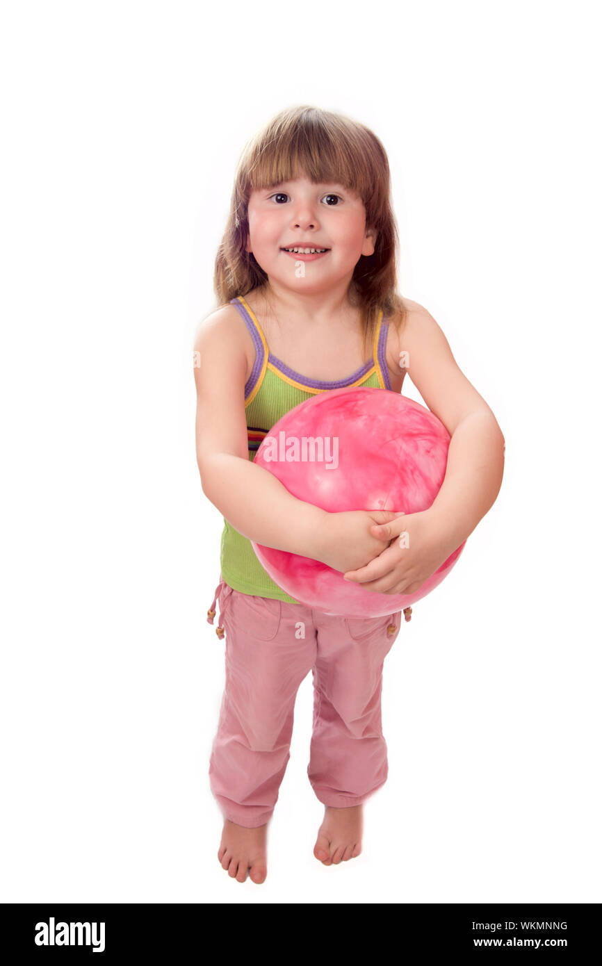 Child standing on floor holding ball isolated on white Stock Photo - Alamy
