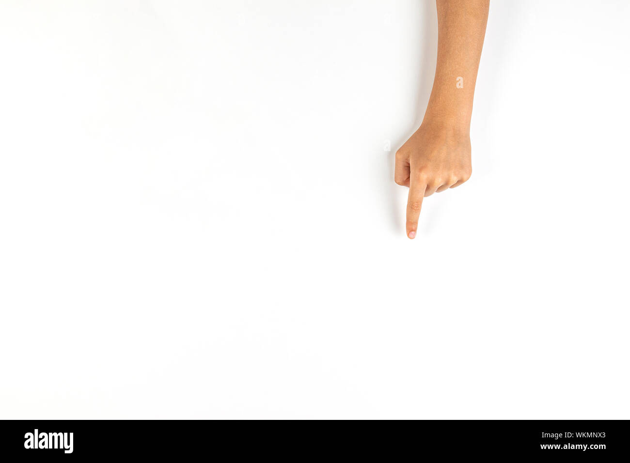 Kid hand pointing with finger to something on white background Stock ...