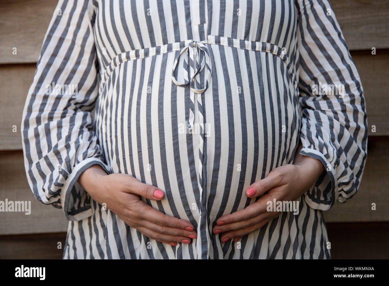 Holding baby bump hi-res stock photography and images - Alamy