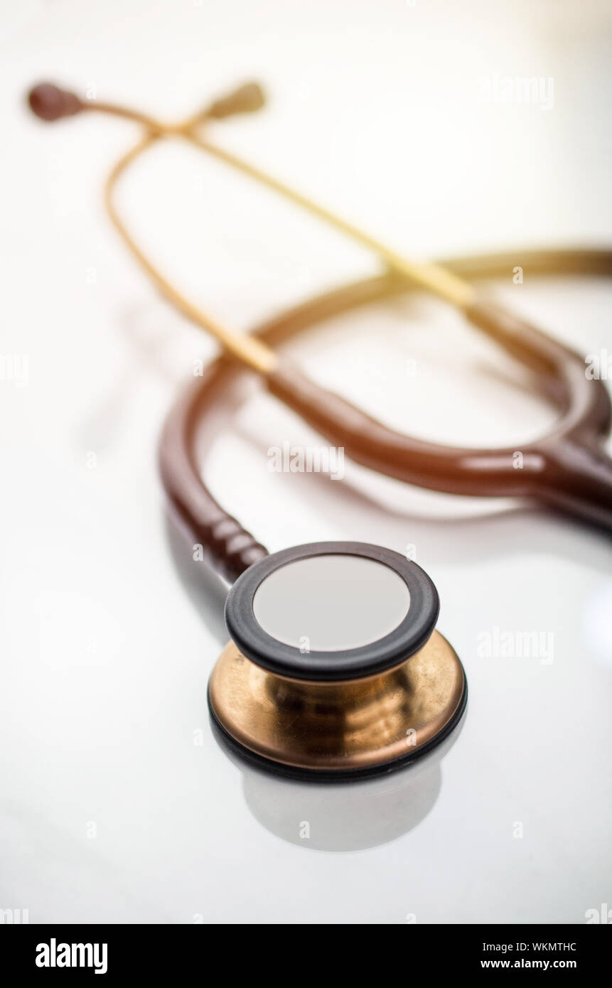 Stethoscope on doctors table, medicine background Stock Photo - Alamy