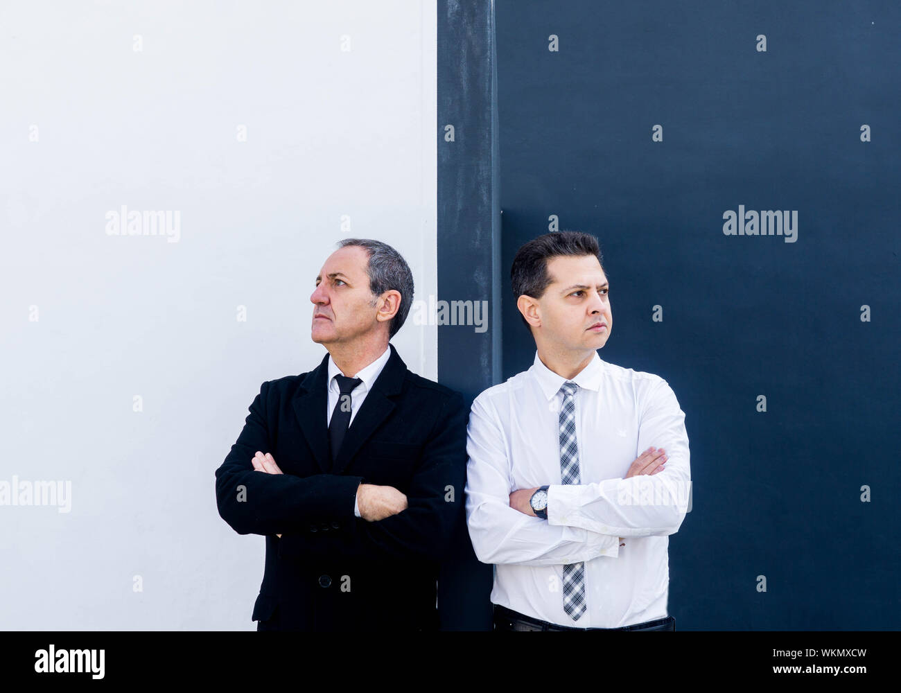 Two men standing with arms crossed hi-res stock photography and images ...