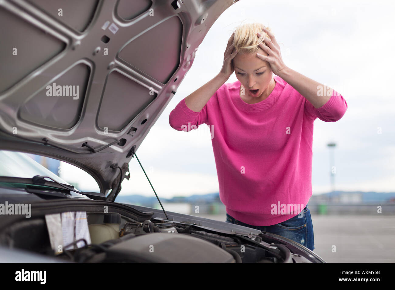 Stressed Young Woman with Car Defect Stock Photo - Alamy