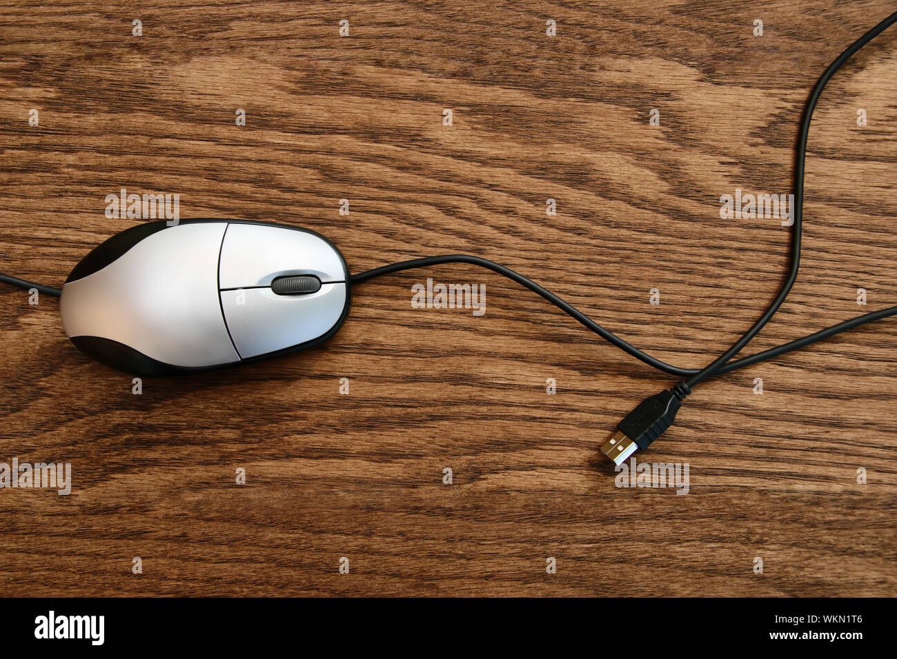 Computer mouse on wooden oak surface Stock Photo - Alamy