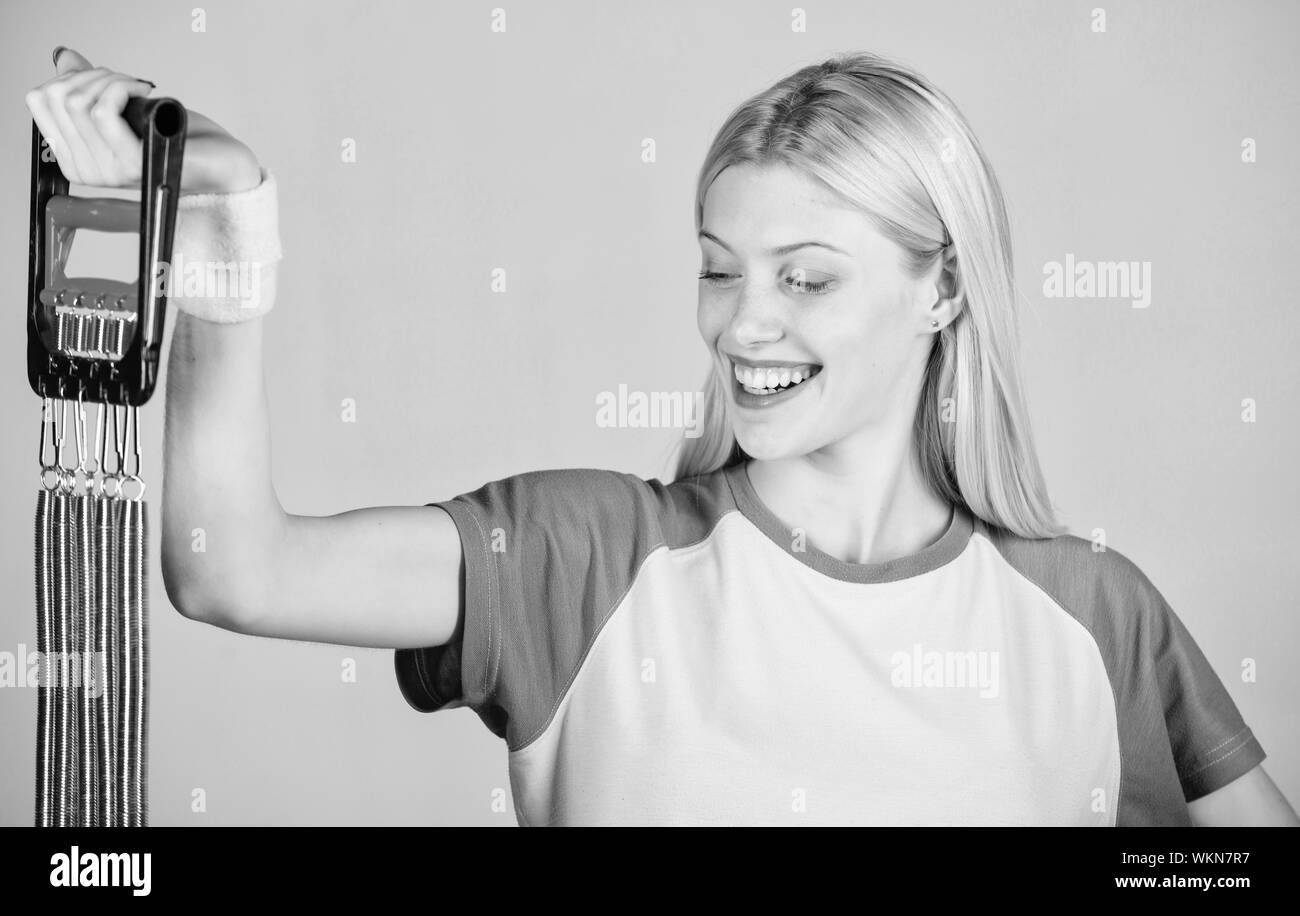 Woman exercising chest expander hi-res stock photography and images - Alamy