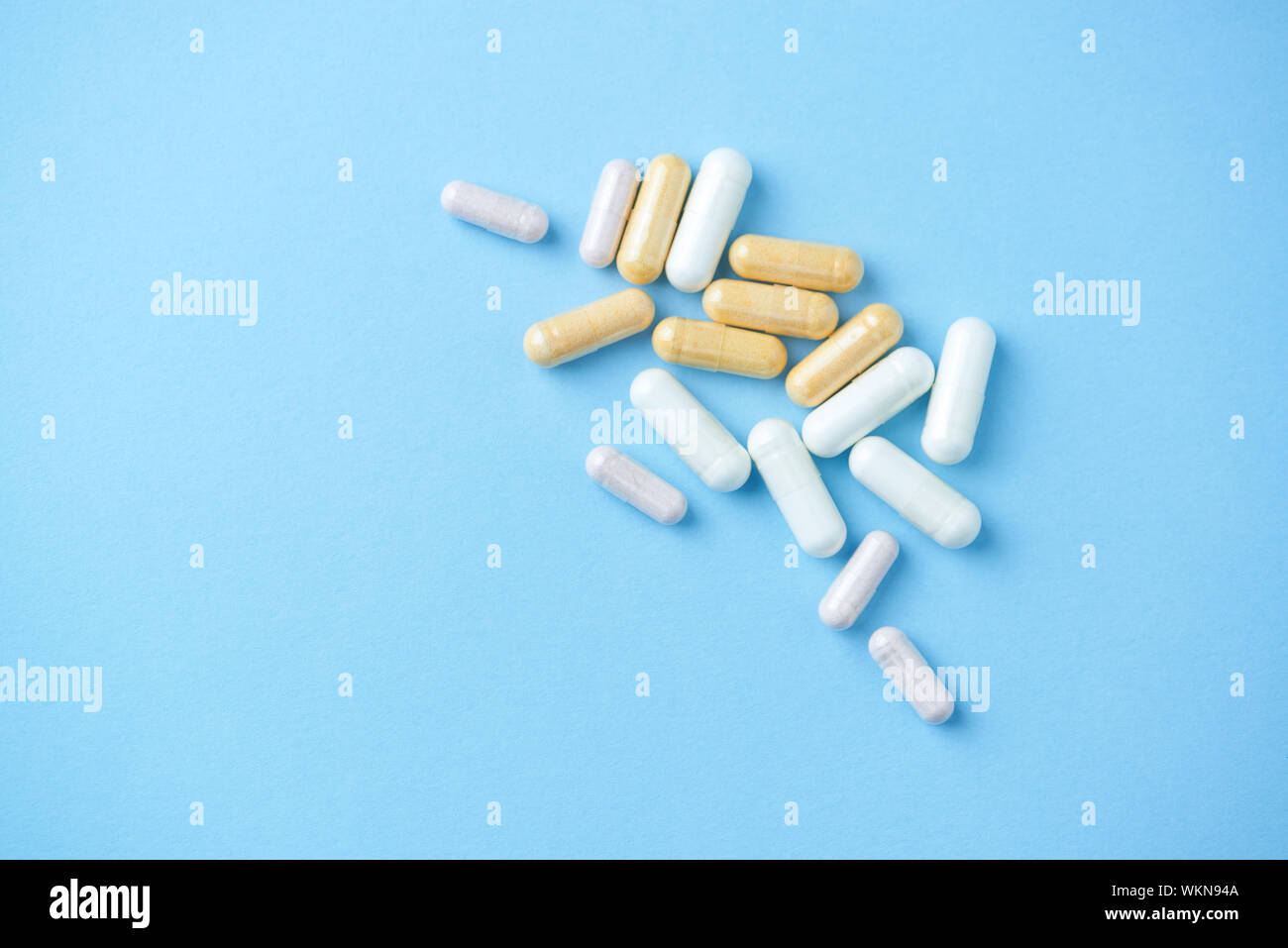 Vitamins and supplements on bright paper background. Concept for a ...