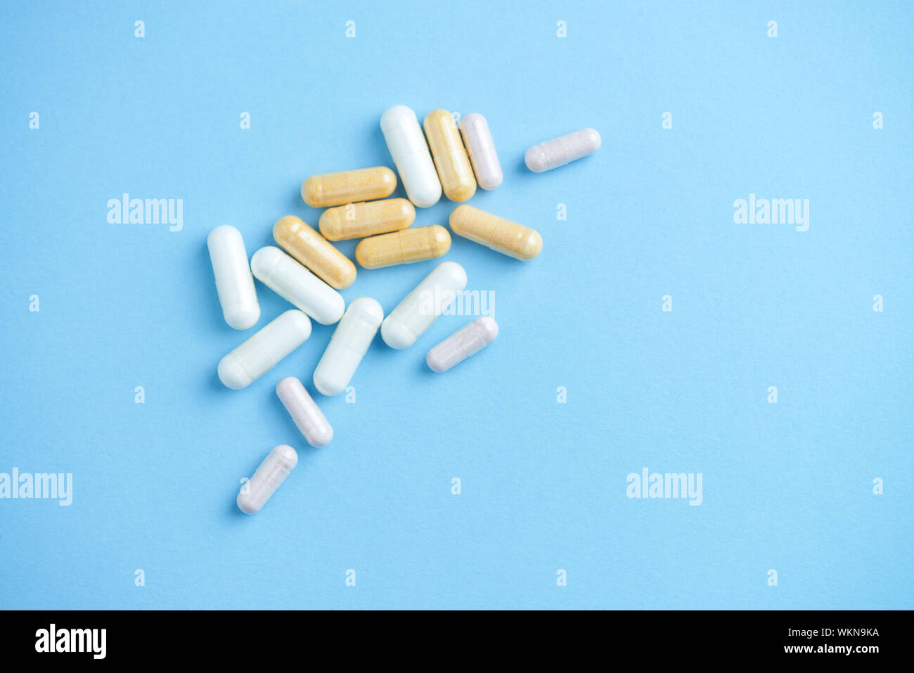 Vitamins and supplements on bright paper background. Concept for a ...