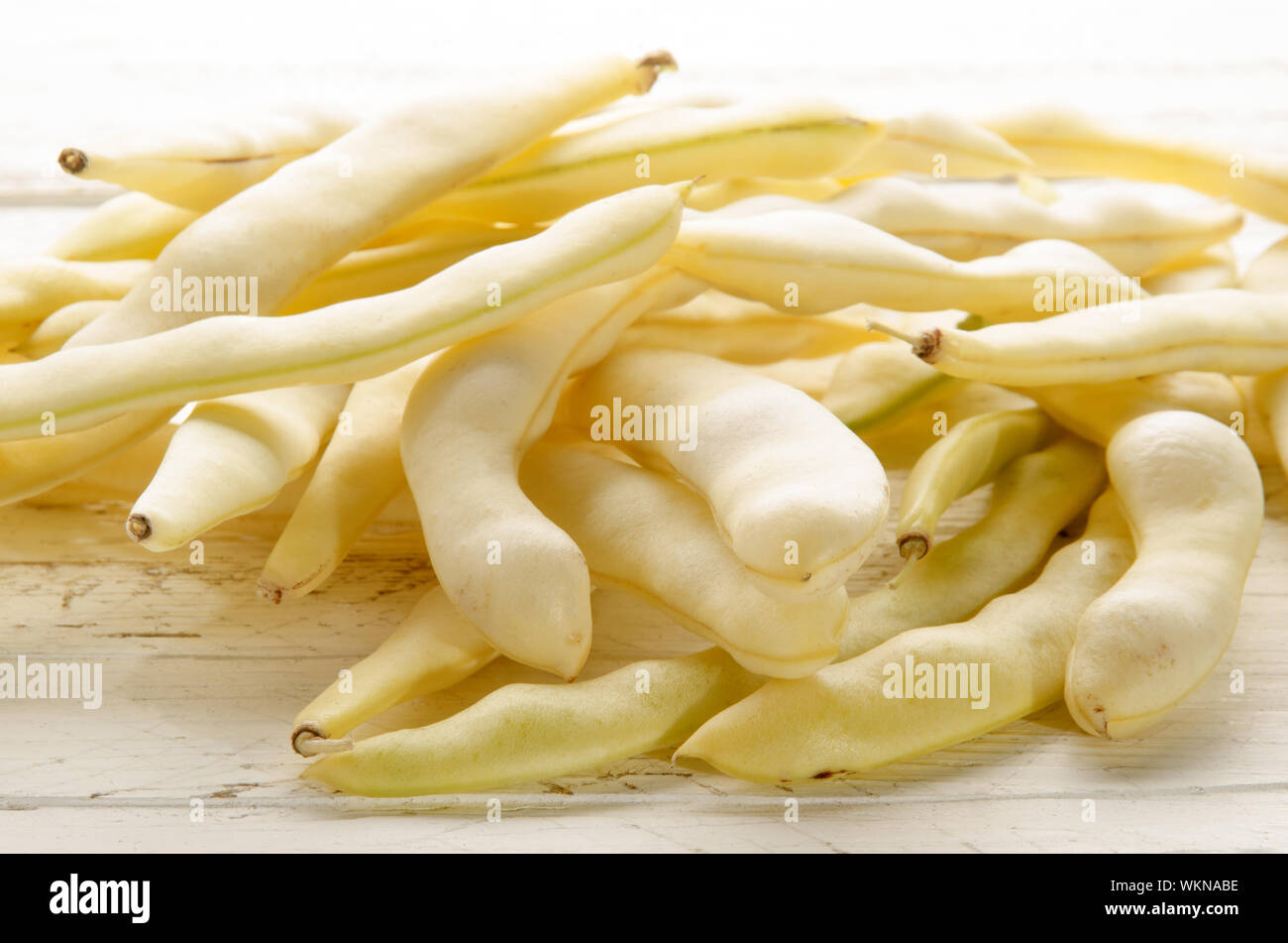 yellow wax beans on a white wood table Stock Photo - Alamy
