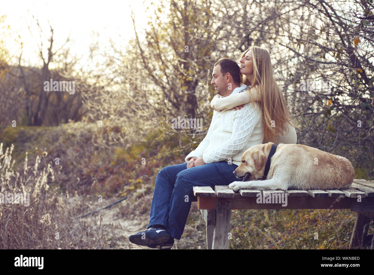 Couple with dog Stock Photo - Alamy