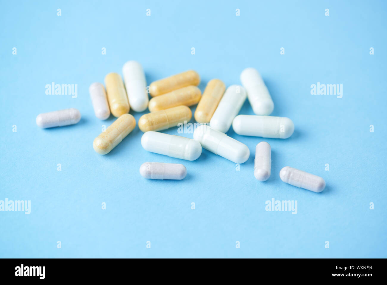 Vitamins and supplements on bright paper background. Concept for a ...