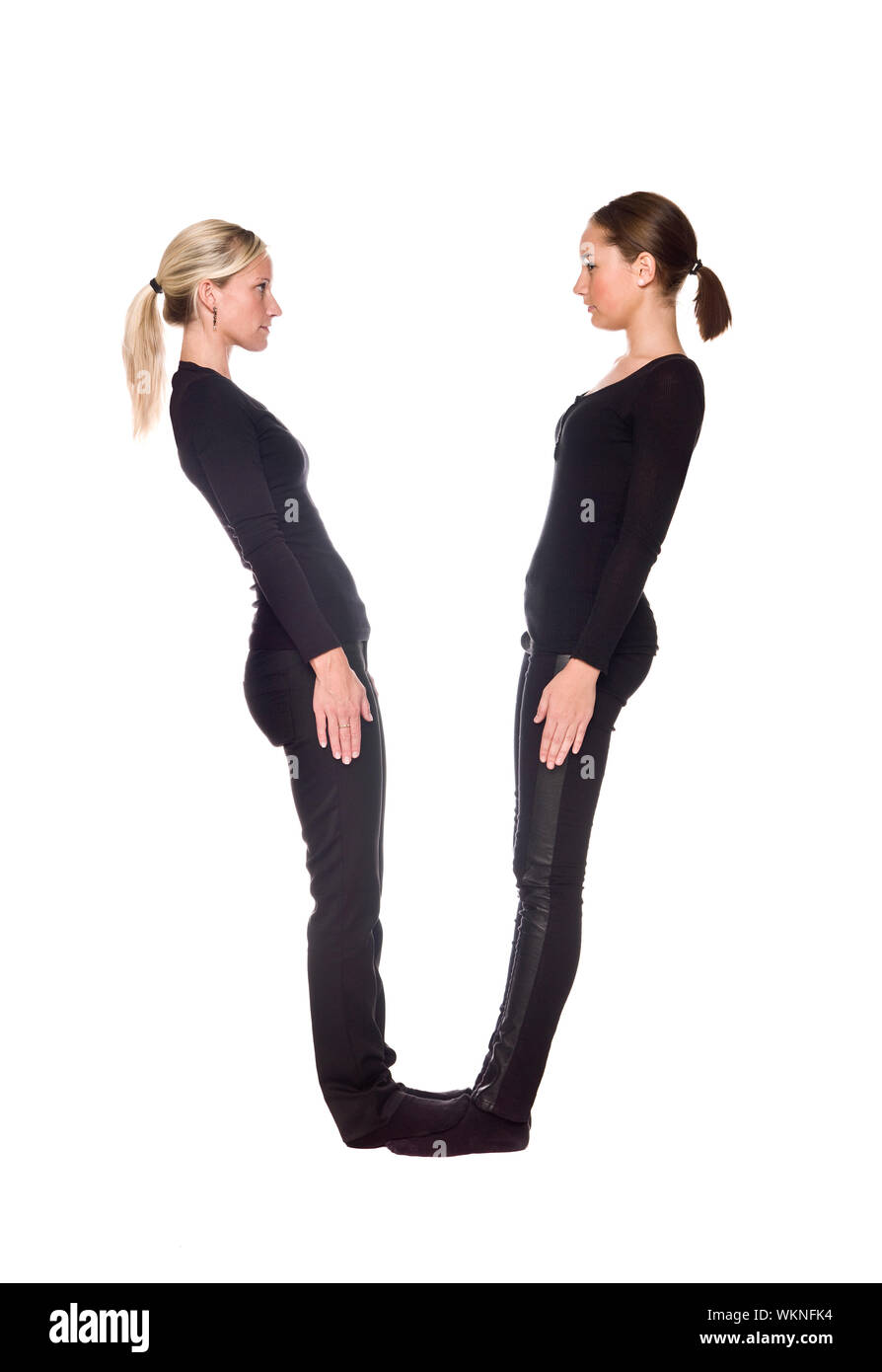 The letter 'V' formed by people dressed in black Stock Photo - Alamy