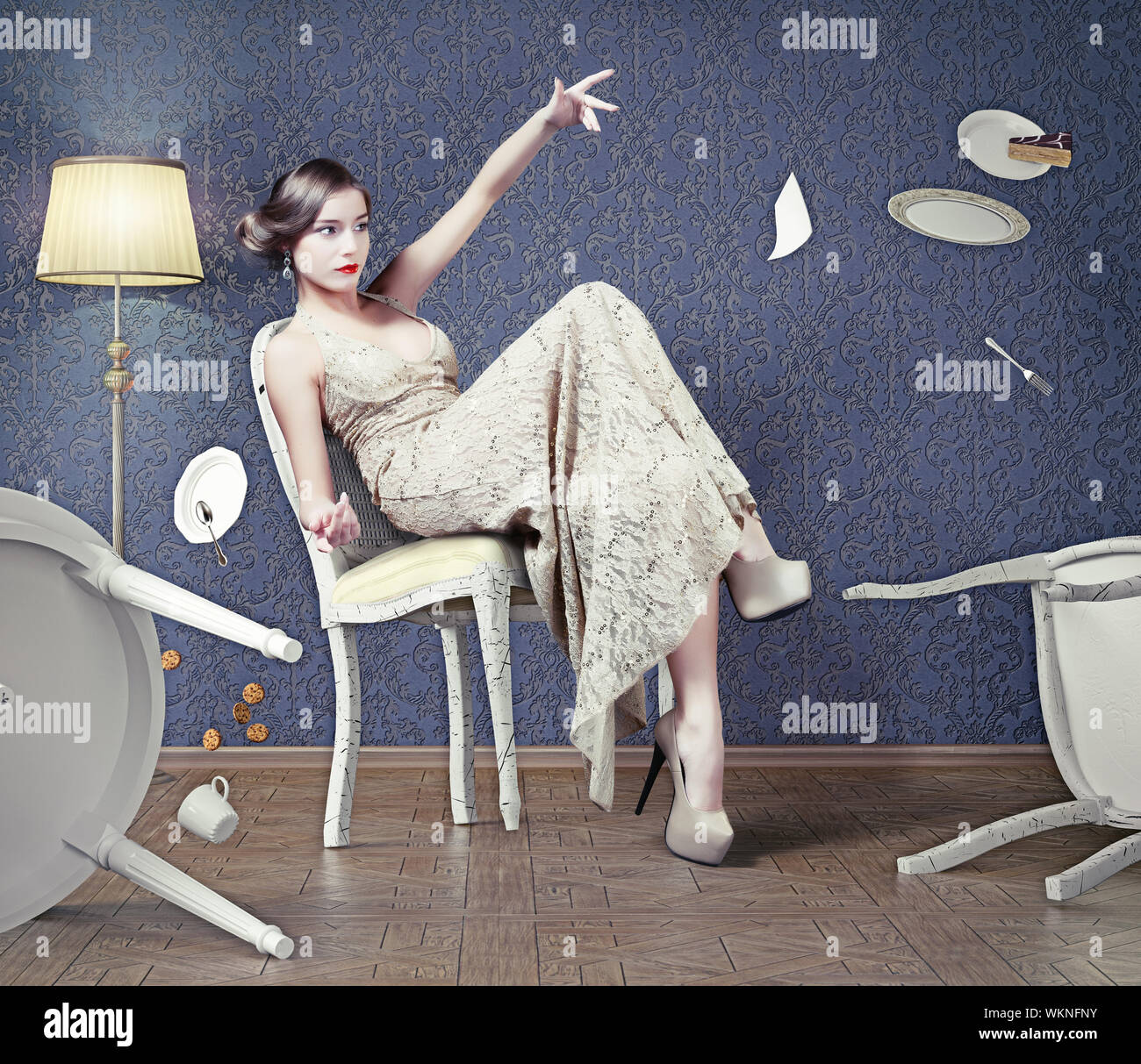 Wicked beautiful woman girl drops the table during dinner Stock Photo ...