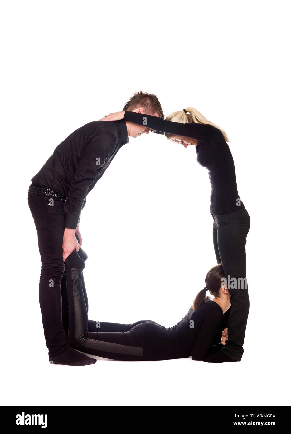 The letter 'O' formed by people dressed in black Stock Photo - Alamy