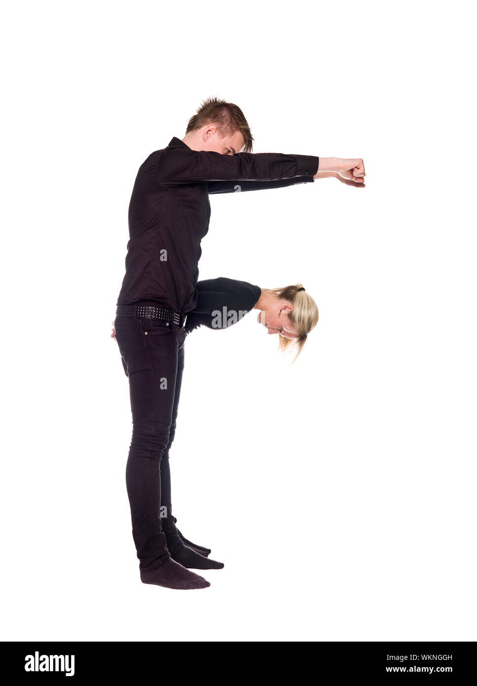 The letter 'F' formed by people dressed in black Stock Photo - Alamy