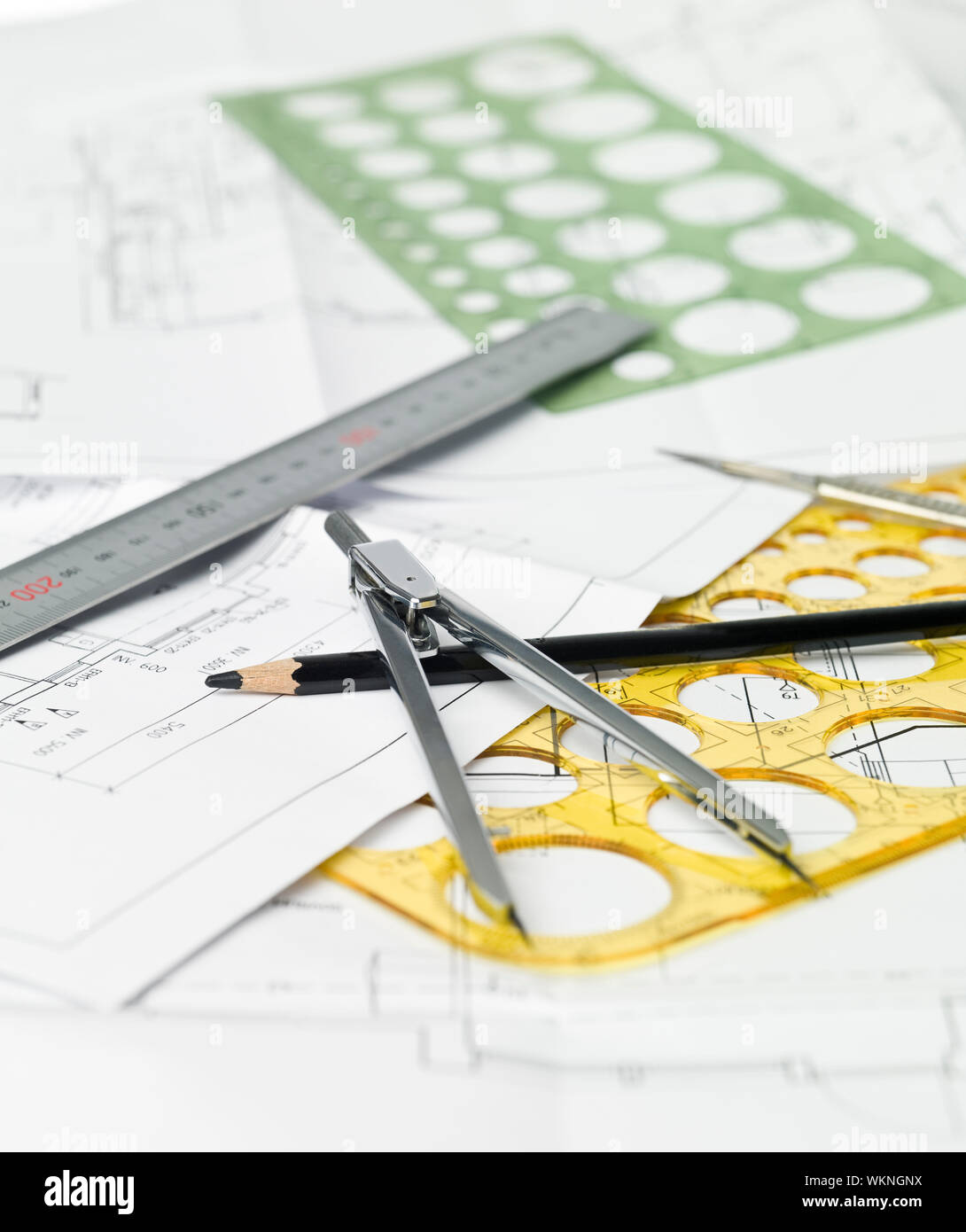 Drawing compass, pen and ruler on blueprints Stock Photo - Alamy