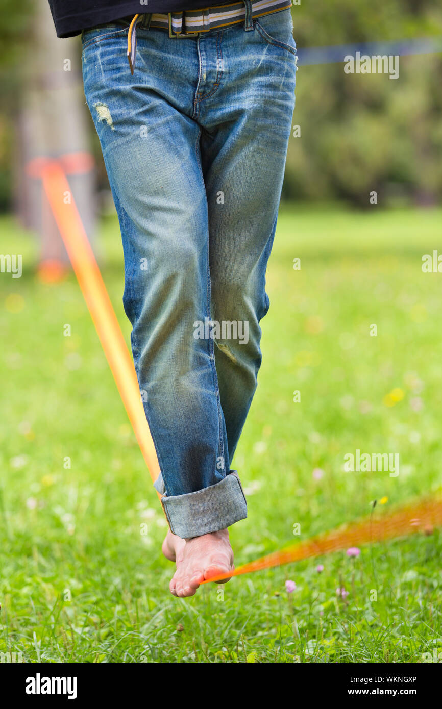 Slack line in the city park Stock Photo - Alamy
