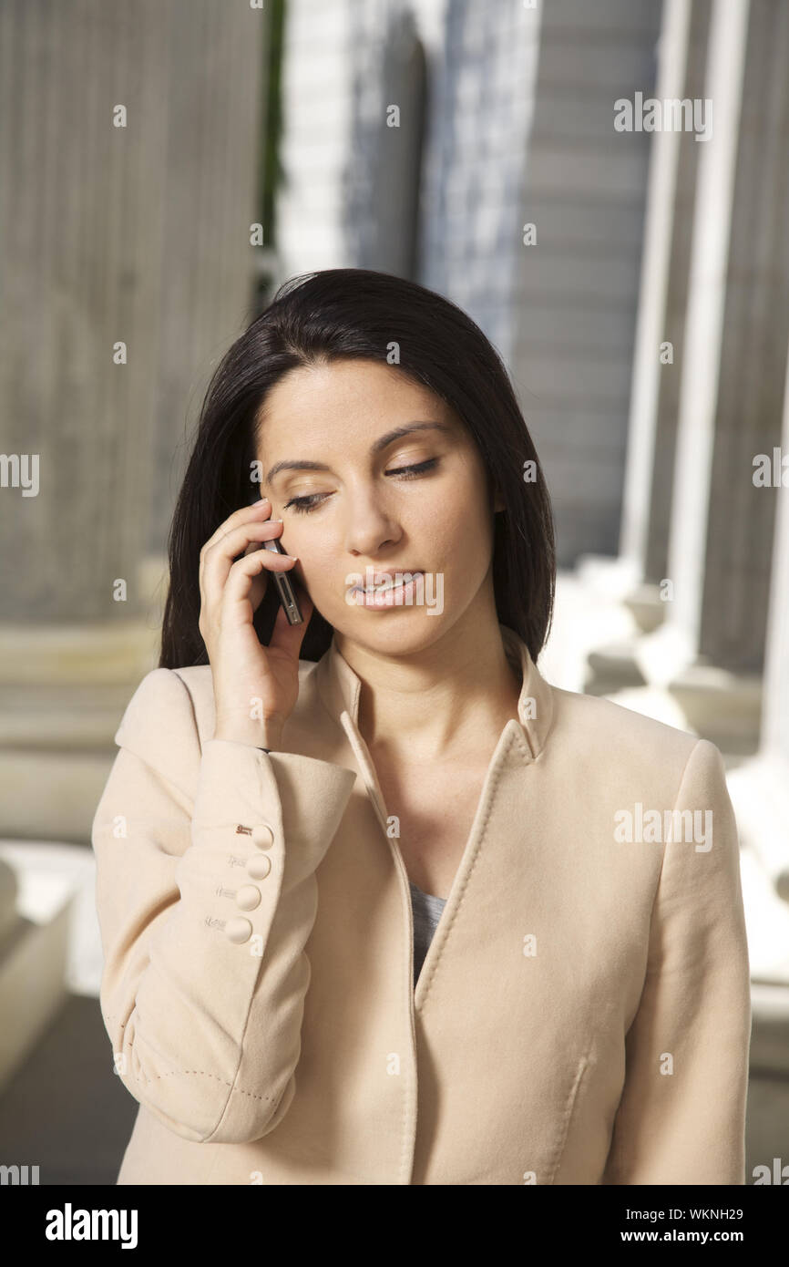 Businesswoman holding mobile telephone hi-res stock photography and ...