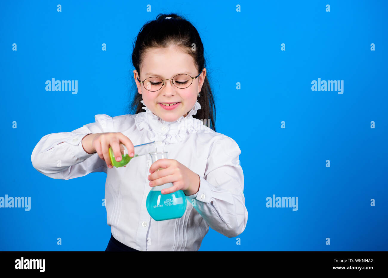 small smart girl with testing flask. child study bilogy lesson. science ...